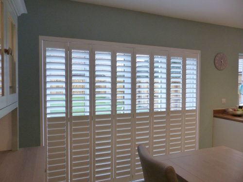 Track mounted shutters for wide openings - Opennshut